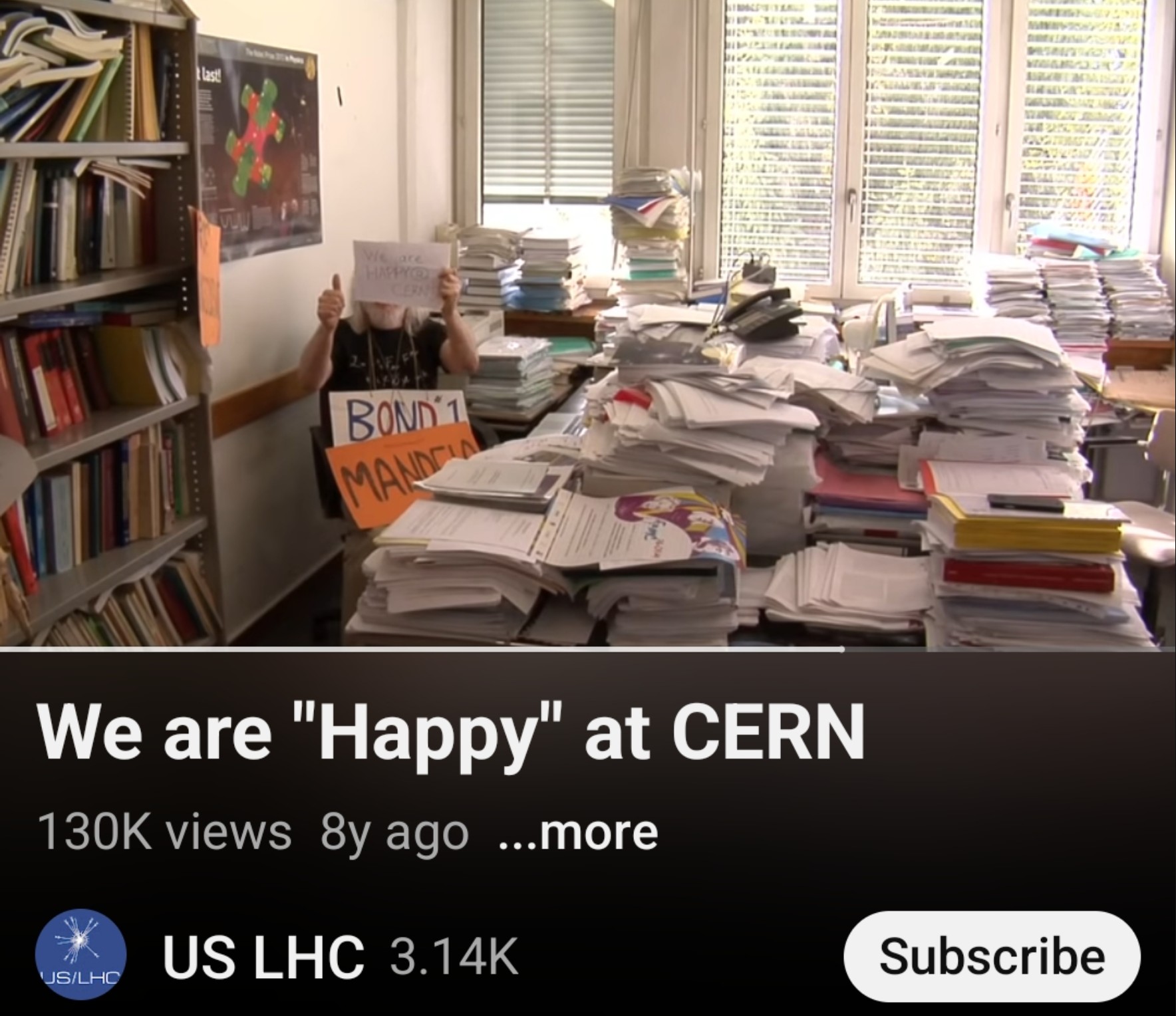 Old CERN faculty photo has this guy with a sign that says "MANDELA ...